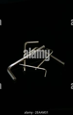 Allen keys with plain black background Stock Photo - Alamy