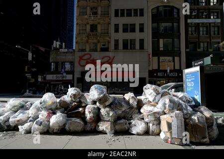 Piles of uncollected garbage seen in lower Manhattan, after two snow ...