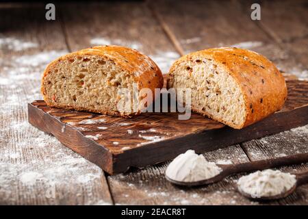 Side view on cut loaf of rustic bread with filling Stock Photo - Alamy
