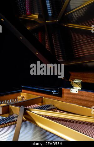 A close-up of the internal parts of a piano or grand piano. Selective ...