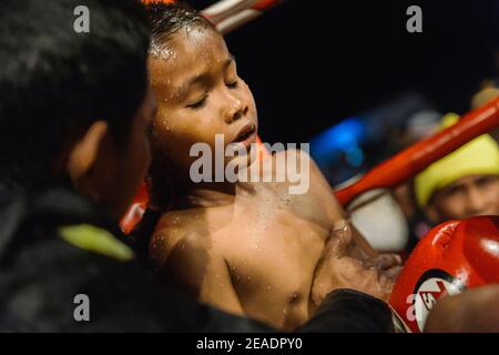 Muay Thai child fighter between rounds in a fight Stock Photo - Alamy