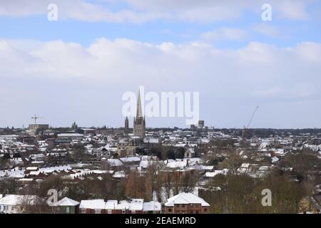 Snow comes to Norwich, UK February 2021. Pedestrians in Timber Hill ...