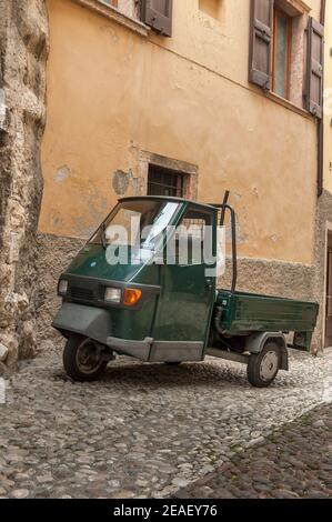 A Piaggio APE 3 wheeled truck outside the church of San Giorgio ...