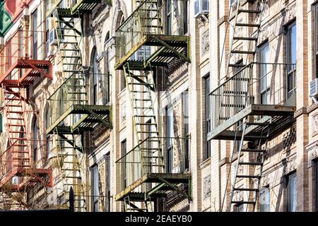 Tenement with fire escapes in Brooklyn as seen through the scratched ...