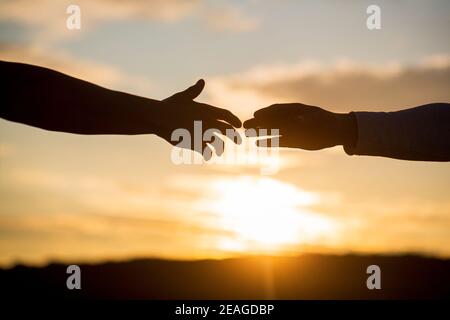 Handshake hand, arm on salvation. Close up help hand. Two hands, helping arm of a friend ...