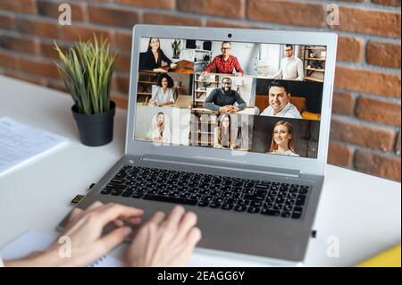 Friends looking at student using virtual reality simulator while ...