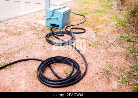 Black pneumatic tube along the road to measure speed and number of ...