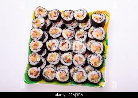 Top view of stack of Japanese sushi maki roll plate. Served in Japanese ...
