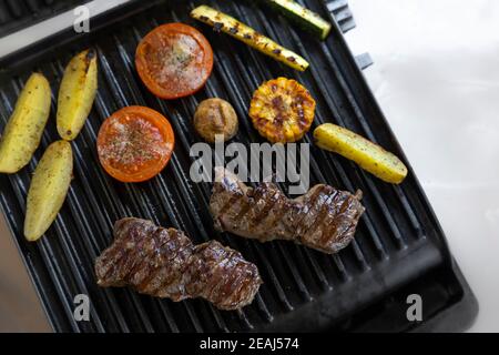 Electric grill with roast beef Stock Photo - Alamy
