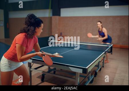 Women play ping pong match, table tennis Stock Photo - Alamy