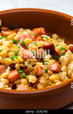 salad of yellow peas, bacon and parsley Stock Photo - Alamy