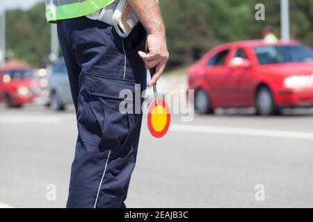 Police officer controlling traffic on the highway Stock Photo - Alamy