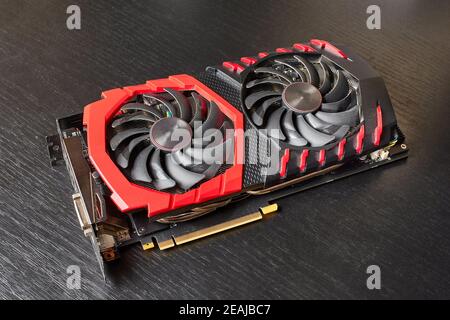 Modern graphics card with fan cooler on white background. Computer ...