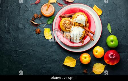 Appetizing baked apple with granola, cinnamon, nuts and honey. Healthy ...
