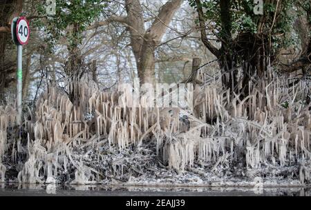 Icicles form at the side of a road near to Penshurst in Kent, as the ...