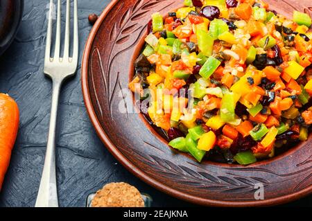 Vegetable saute of seasonal vegetables, eggplant with tomatoes on a ...