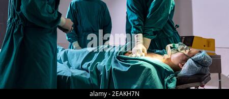 Panorama Surgeon doctor and nurse do CPR to patient while patient have ...