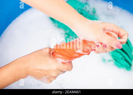 Female squeeze wring out wet fabric cloth Stock Photo - Alamy