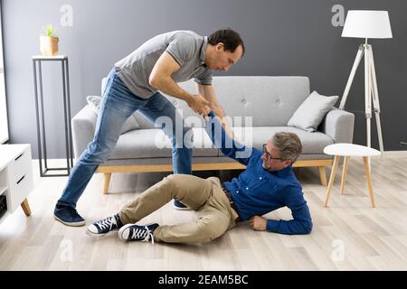 Helping Elder Senior Fallen Man After Fall Accident Stock Photo - Alamy