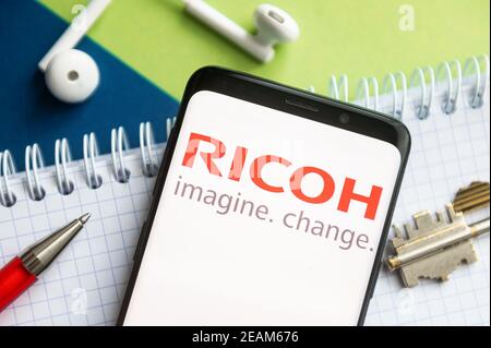 In this photo illustration, a Ricoh logo seen displayed on a smartphone ...