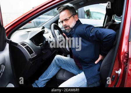 Car Driving Pain Back Injury. Bad Posture Stock Photo - Alamy