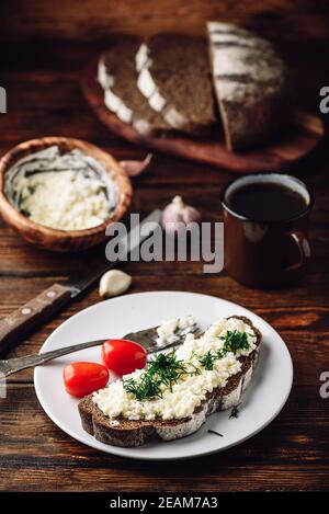 Rye bread toast with cream cheese and avocado on a beautiful plate ...