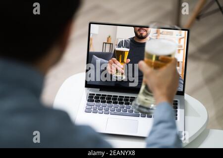 Online Virtual Beer Drinking Party On Laptop Stock Photo - Alamy