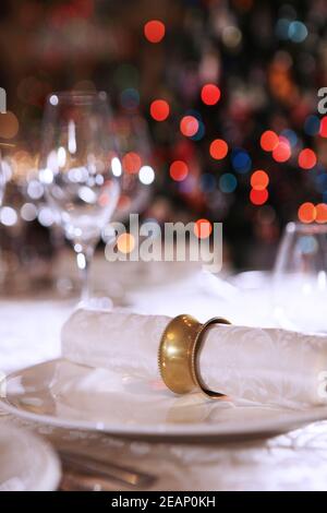 White gold ring rests on red gift box, bouquet of flowers on white ...