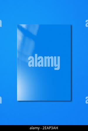 Blue booklet cover isolated on colorful background, mockup template ...