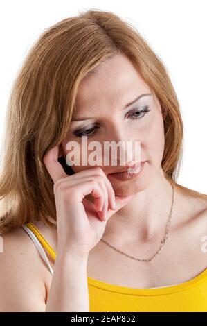 Young emotional man, looking down at pda on beige background Stock ...