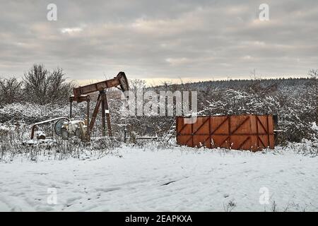 Oil rig on snowy field against sky at Alaska Stock Photo - Alamy