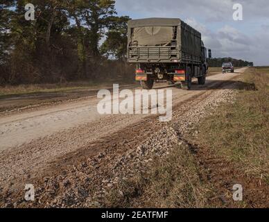 MAN SV 4x4 army logistics vehicle truck driving along a dirt track in ...