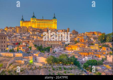 Night view of cityscape of Toledo dominated by Alcazar castle, Spain ...