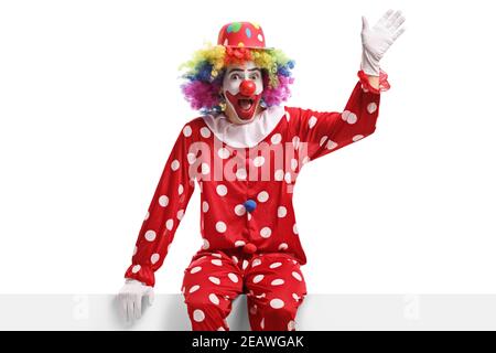Funny cheerful clown waving isolated on white background Stock Photo ...