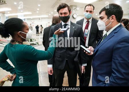 Sen. Jon Ossoff, D-Ga., speaks before President Joe Biden at a campaign ...