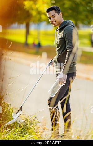 Volunteer conserving environment from pollution and plastic Stock Photo ...