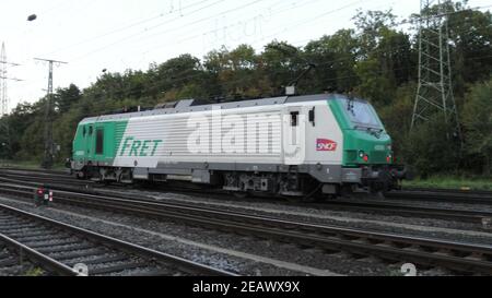 A SNCF Alstom Prima El3U electric powered locomotive with goods wagons ...