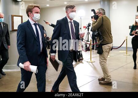 Sen. John Hickenlooper (D-Colo.) arrives for a vote at the U.S. Capitol ...