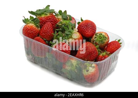 Plastic container with strawberries isolated on a white background. Fresh and ripe summer ...