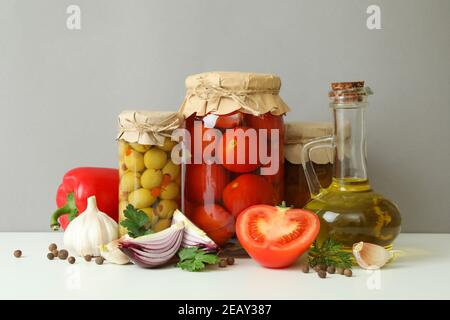 Different pickled food and ingredients against gray background Stock ...
