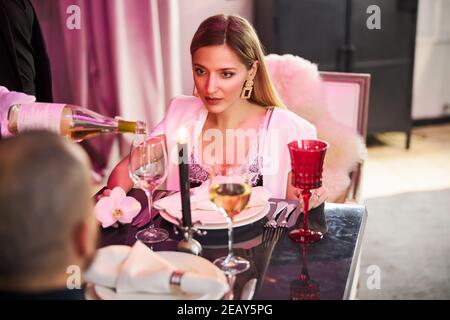 Pretty lady and her beau in a restaurant Stock Photo - Alamy
