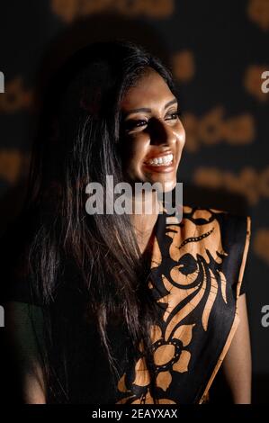 Write with light at long exposure in the dark. A middle-aged woman ...