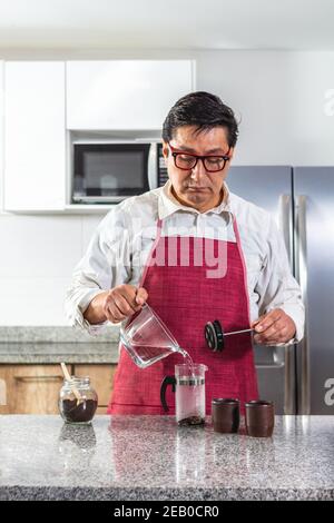 Vertical shot of a coffee making machine in the kitchen Stock Photo - Alamy