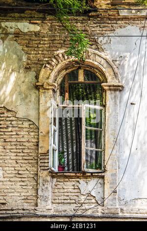 Wall peeling and exposing stone bricks in Spain Stock Photo - Alamy