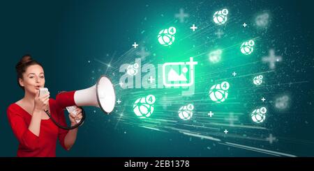 Young person with megaphone and social networking icon Stock Photo - Alamy