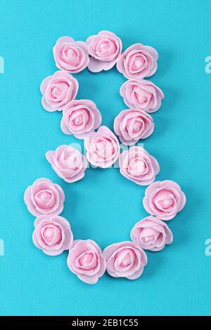 Happy woman's day. March 8. Roses, teddy bear and chalkboard on a white ...