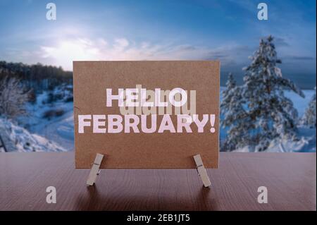 Hello February winter time card with frosty window Stock Photo - Alamy