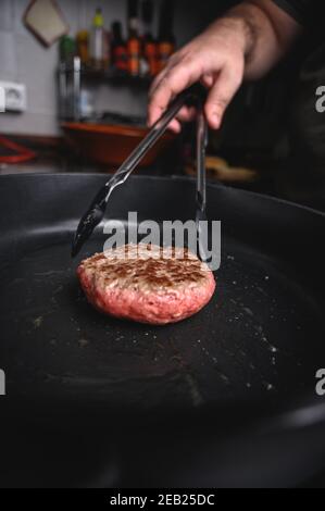 Closeup shot of a homemade hamburger cutlet frying in a pan Stock Photo ...