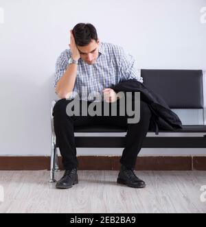 The man nervously impatiently waiting in the lobby Stock Photo - Alamy