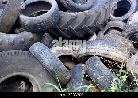 A waste heap of old tyres for rubber recycling Stock Photo - Alamy